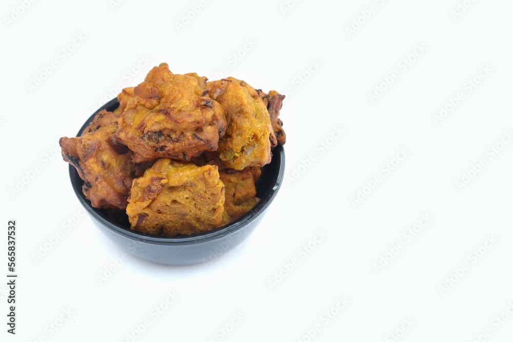 Closeup of Masoor Dal Pakoda or Red Lentil Vada in a Black Bowl ...
