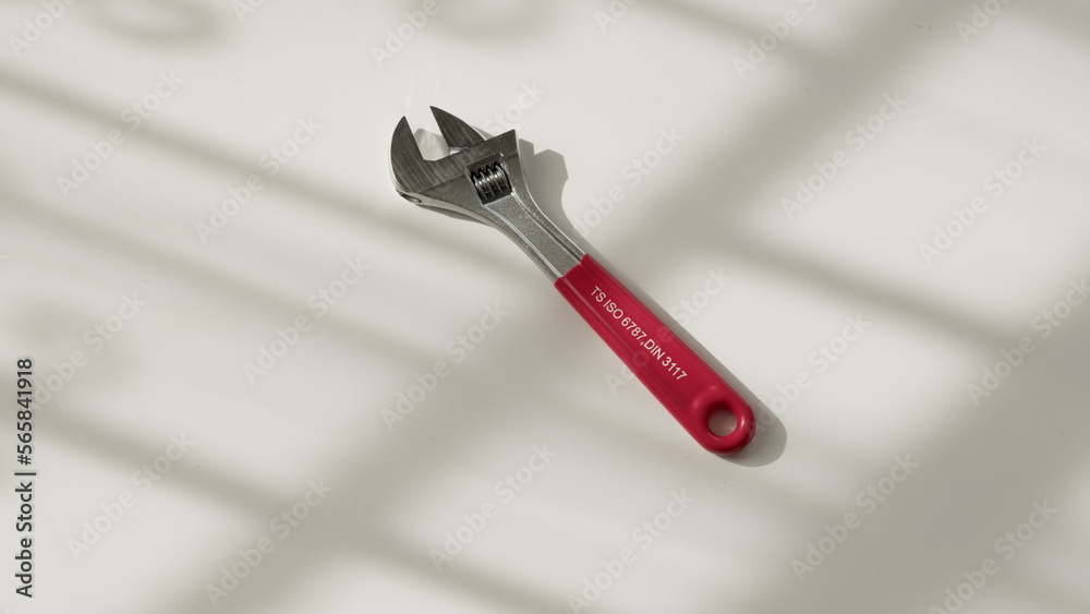 adjustable wrench lay white background on floor. concept of worker and ...