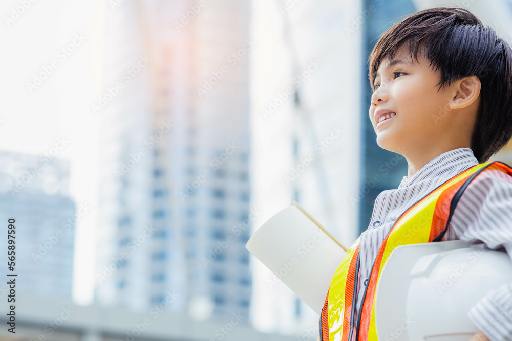 Asian happy kid holding white construction helmet or safety hard hat ...