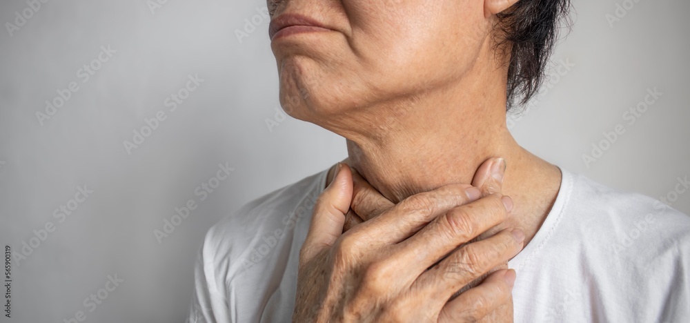 Pain at neck of Asian man. Concept of sore throat, pharyngitis ...
