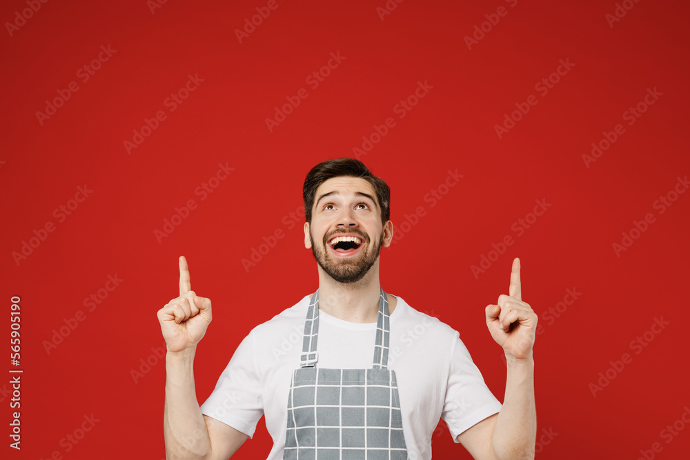 Young housewife housekeeper chef cook baker man wear grey apron point ...