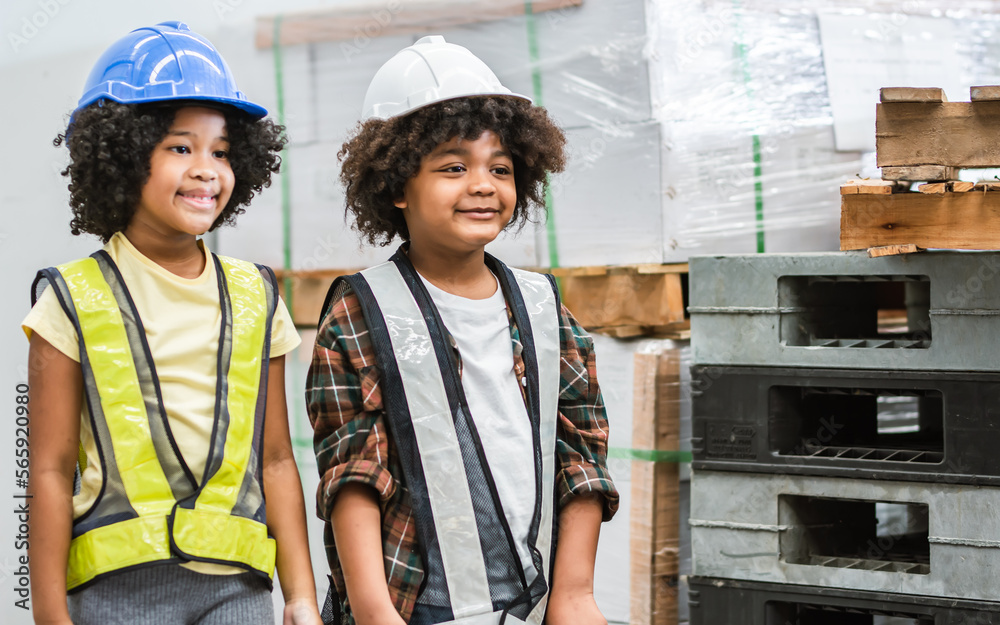 Foto de Two African little boy, girl kids standing in warehouse, dream ...