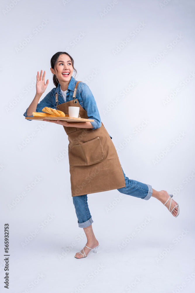 young asian waitress barista wearing apron hand hold bread and coffee ...