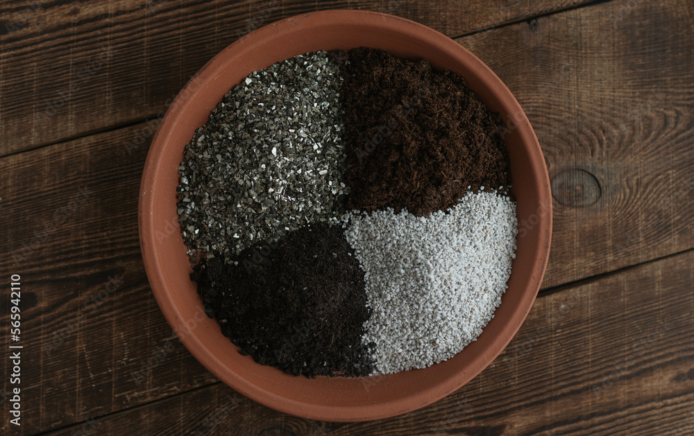 Soil components peat, bio humus, perlite, vermiculite on a clay tray ...