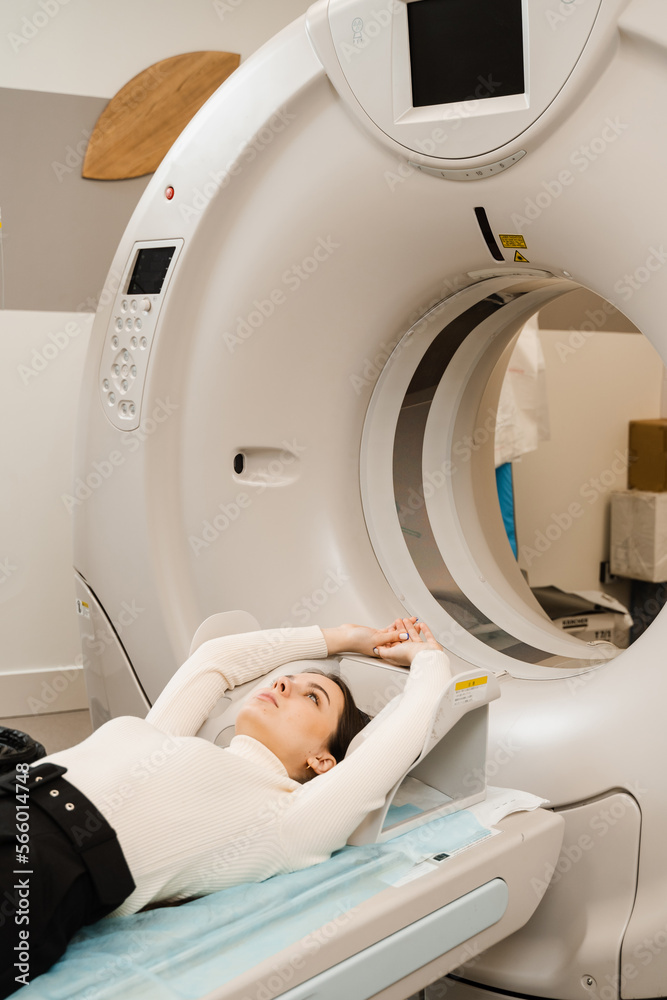 Girl patient is doing CT computed tomography x-ray scan of chest for ...