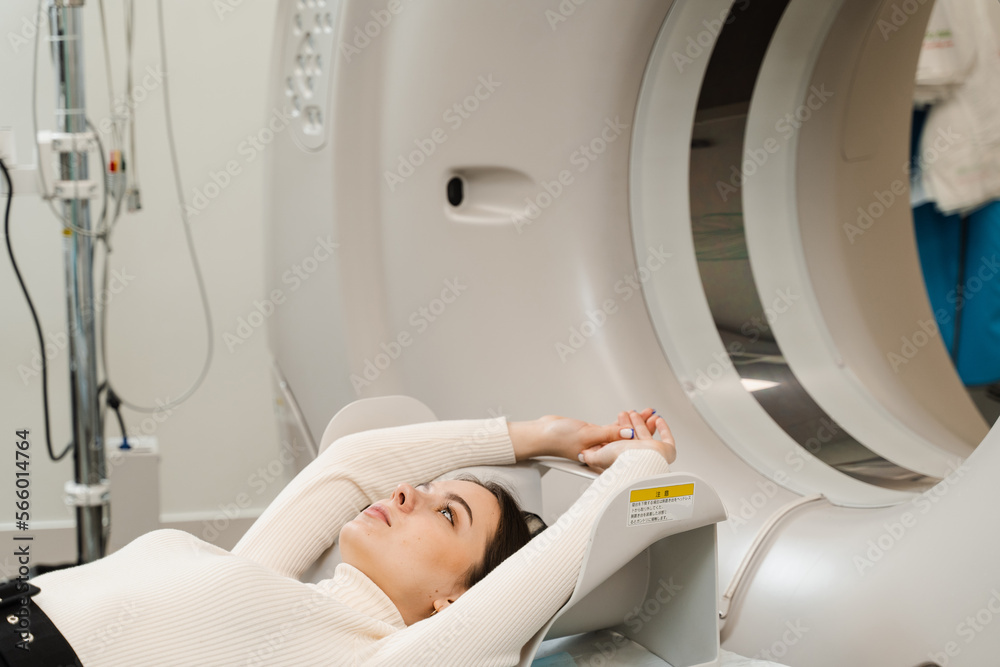 Girl patient lies on computed tomography bed and scanning lungs for ...