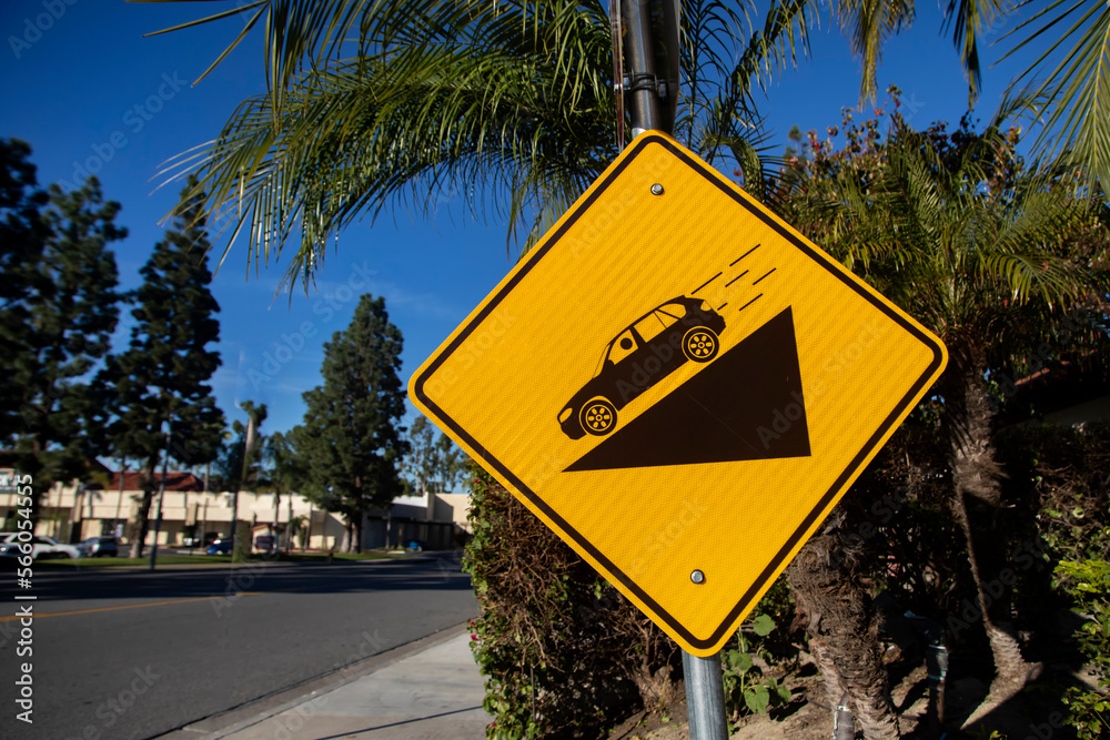 Yellow sign with graphic indicating a very steep slope Stock Photo ...