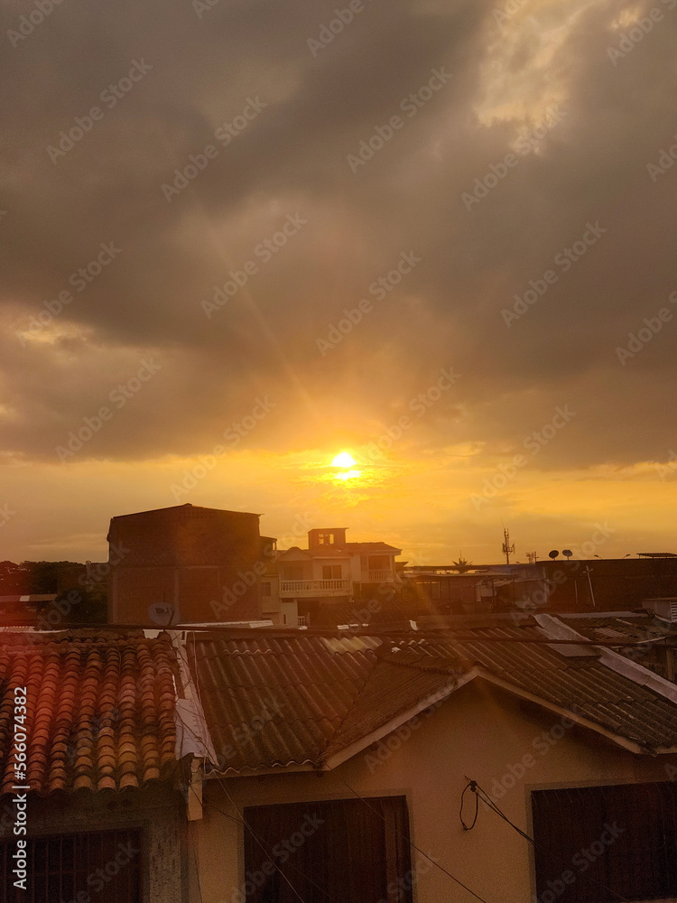 sunrise in city with buildings and sun in the background Stock Photo ...