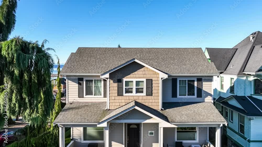 4k video clip of a modern American craftsman style suburban home ...