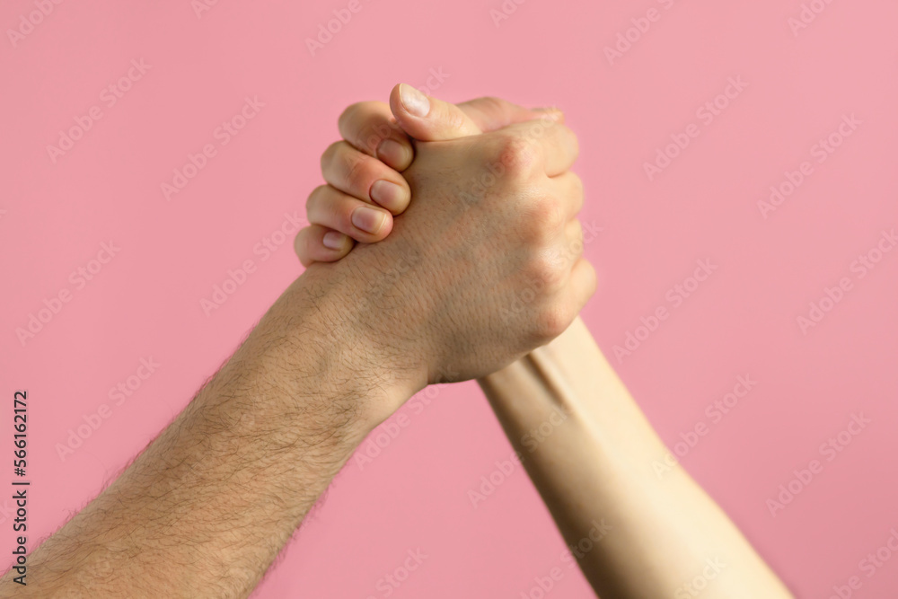 hands of man and woman in struggle for gender equality, female ...