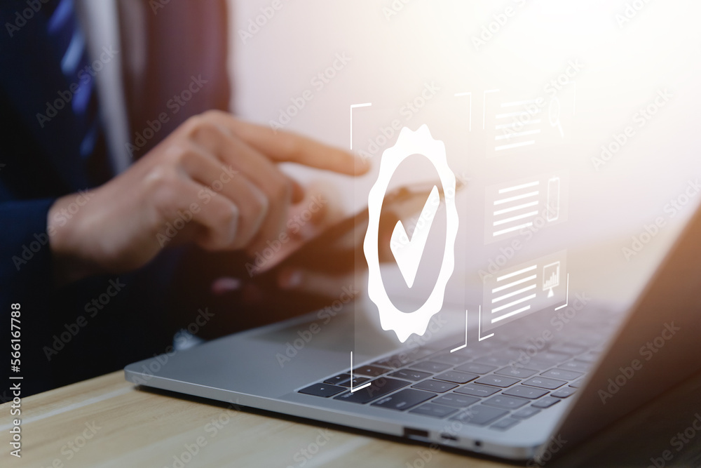 Businessman using a laptop showing check mark icon. Best quality ...