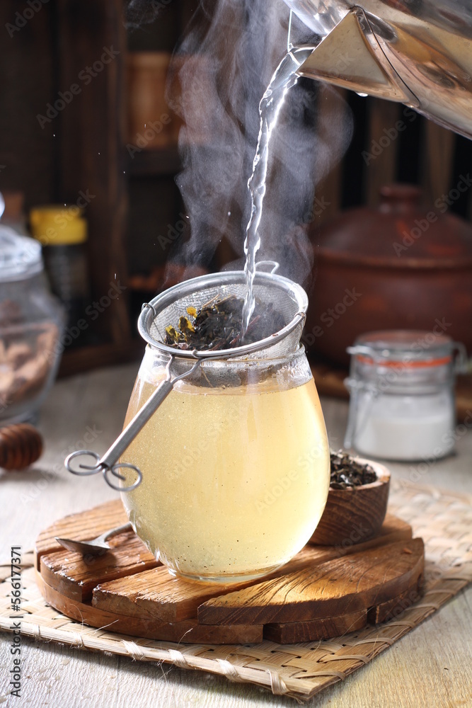 Tea is an aromatic beverage prepared by pouring hot or boiling water ...