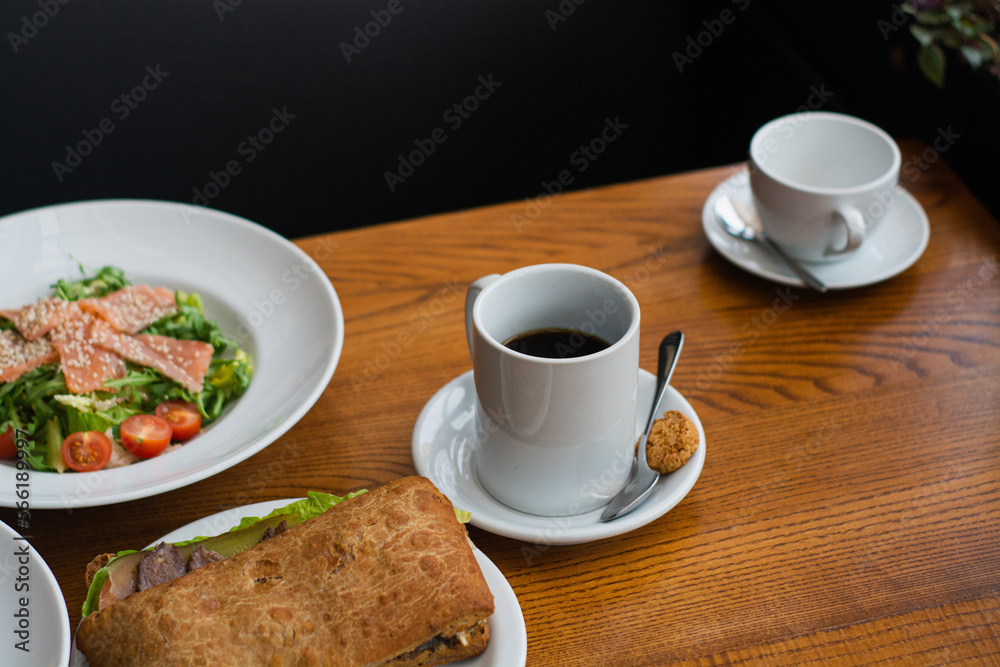 Full table of delicious and different dishes in cafe with cup of coffee ...