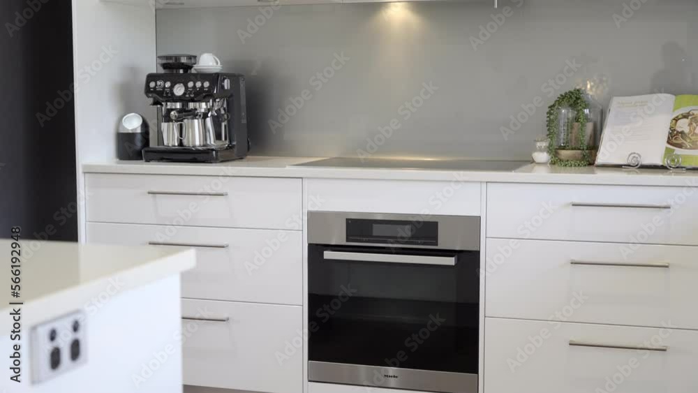Contemporary modern kitchen. White stone top bench. Large modern ...