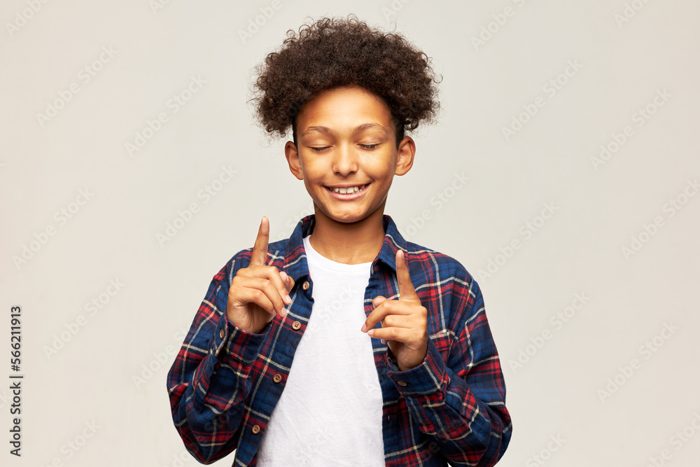 Funny picture of handsome kid explaining something, pointing index ...