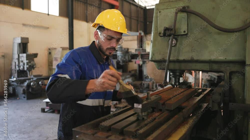 the industry operator uses the brush for cleaning and painting rust ...