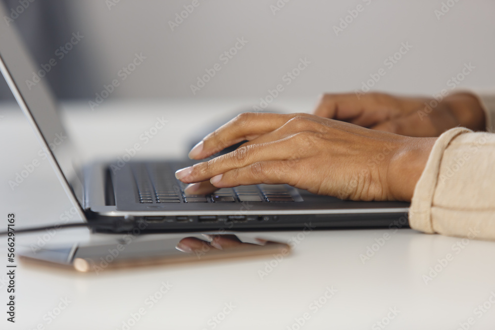 BIPOC woman typing text on laptop keyboard. Close up photo of POC ...