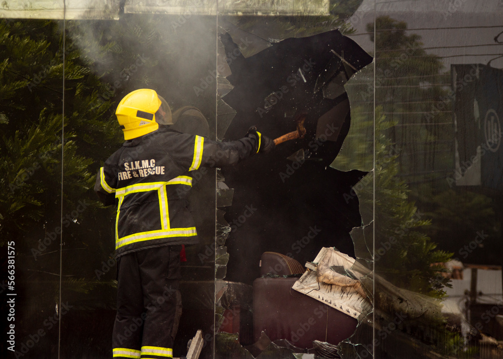 National Fire Fighter of Sri Lanka trying to fight a fire going on in a ...