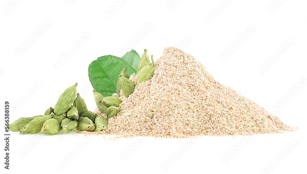 Pile of ground cardamom, green leaves and whole capsules of cardamom ...