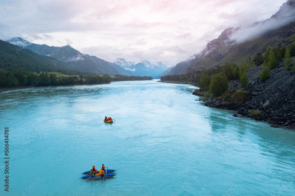 Team extreme rafting on red boat on stormy blue river Altai, Aerial top ...