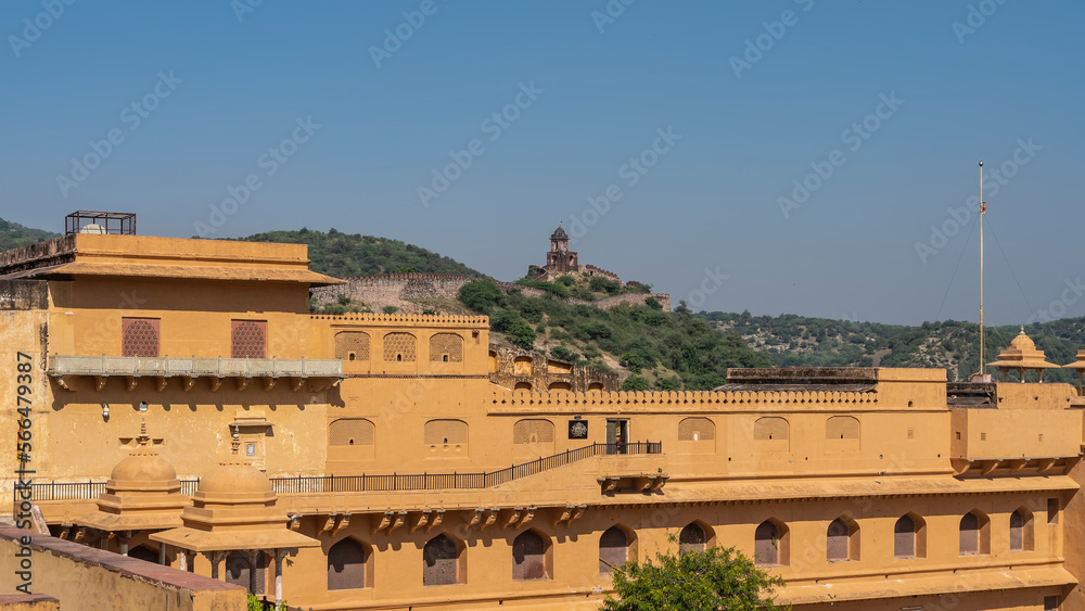 The ancient Amber Fort is built of orange sandstone. Lattice windows ...