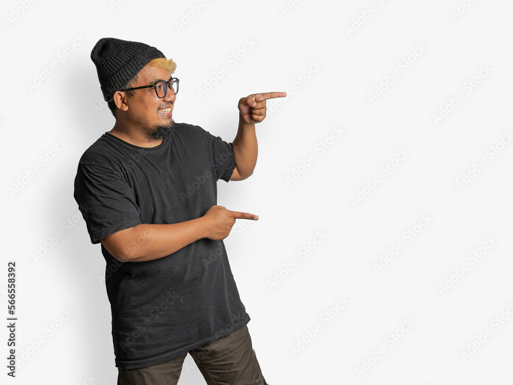 Asian man set pointing with two hand in right direction. A casual ...