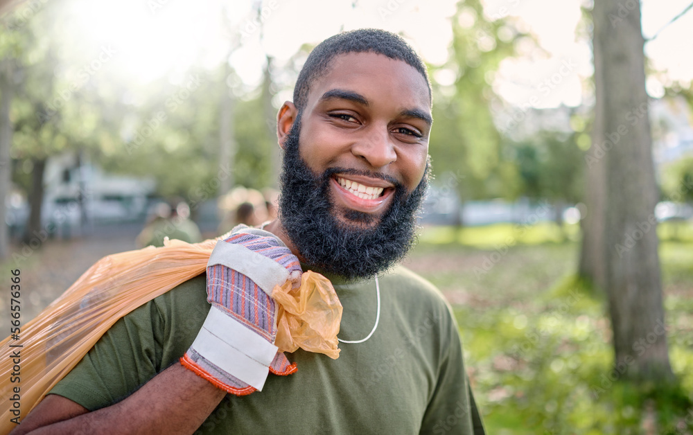 Plastic bag, park and black man cleaning for earth day, eco friendly or ...