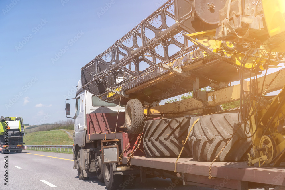 Heavy industrial truck with low side on low-frame platform transports ...
