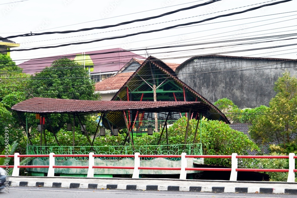 a unique tropical-style building that stands firmly with a large and ...