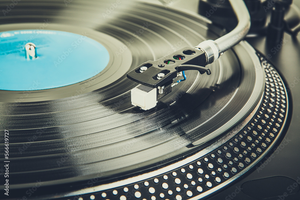 Playing a vinyl record on a turntable Stock Photo | Adobe Stock