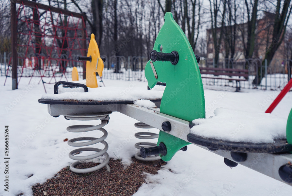 playground in winter in the snow. Sandbox in the snow, swings, gazebos ...