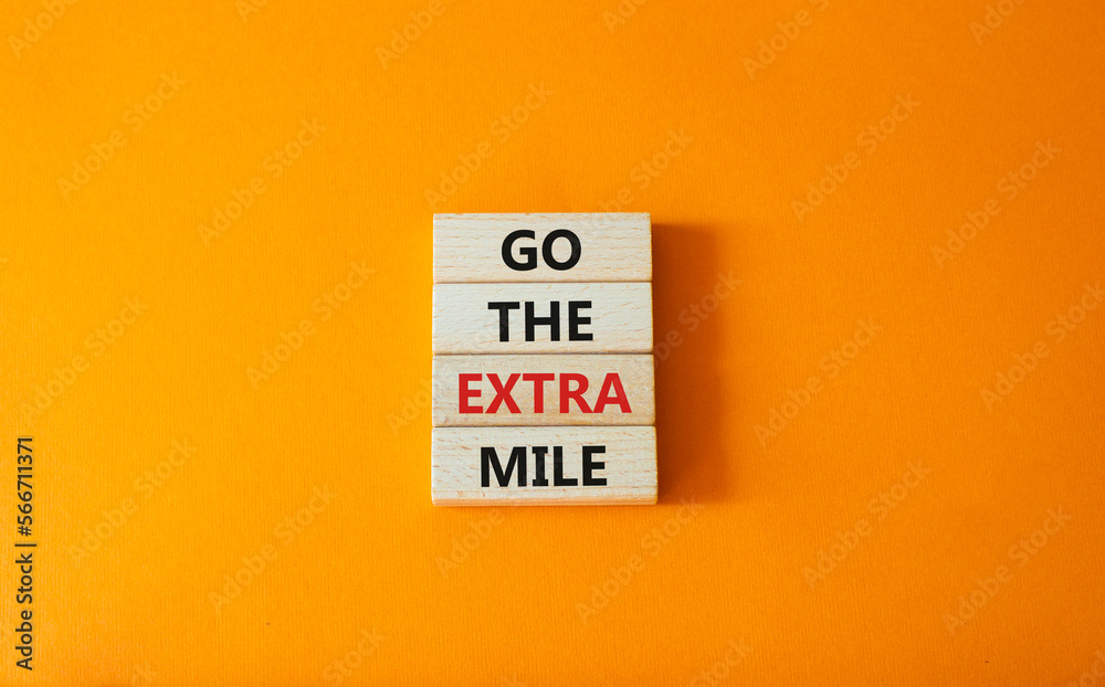 Go the extra mile symbol. Wooden blocks with words Go the extra mile ...