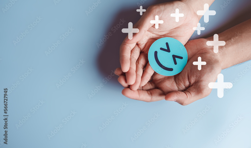 Hands holding blue happy smile face, good feedback rating, positive ...