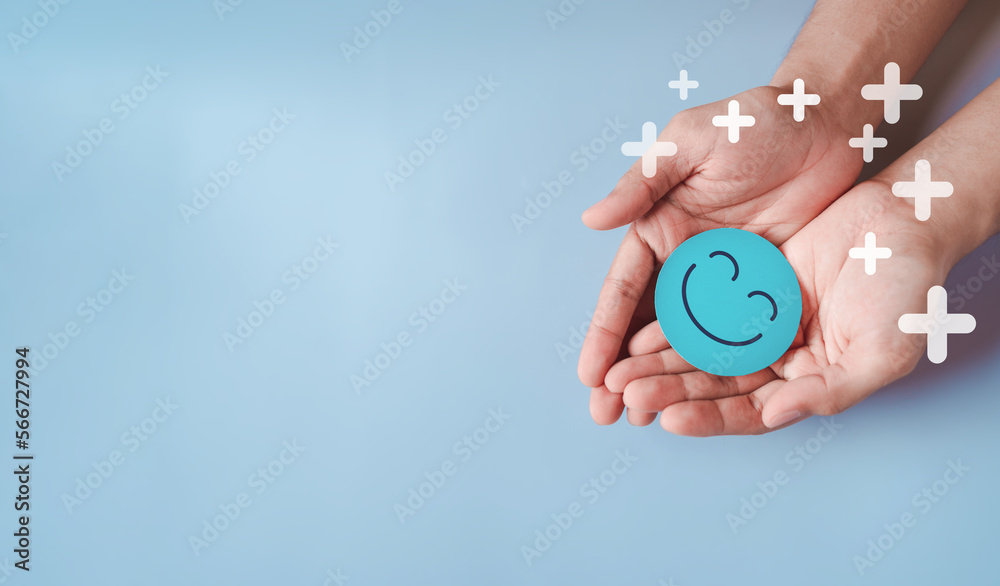 Hands holding blue happy smile face, good feedback rating, positive ...