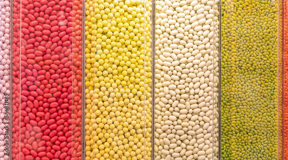 Multi-colored candies and gums in a shop window. Food texture. Stock ...