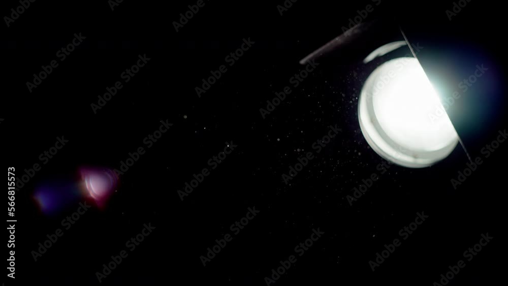 A close-up of how the lighting device shines in the cinema. Spotlight ...