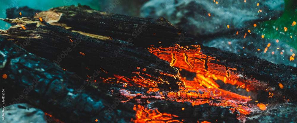 Vivid smoldered firewoods burned in fire close-up. Atmospheric warm ...