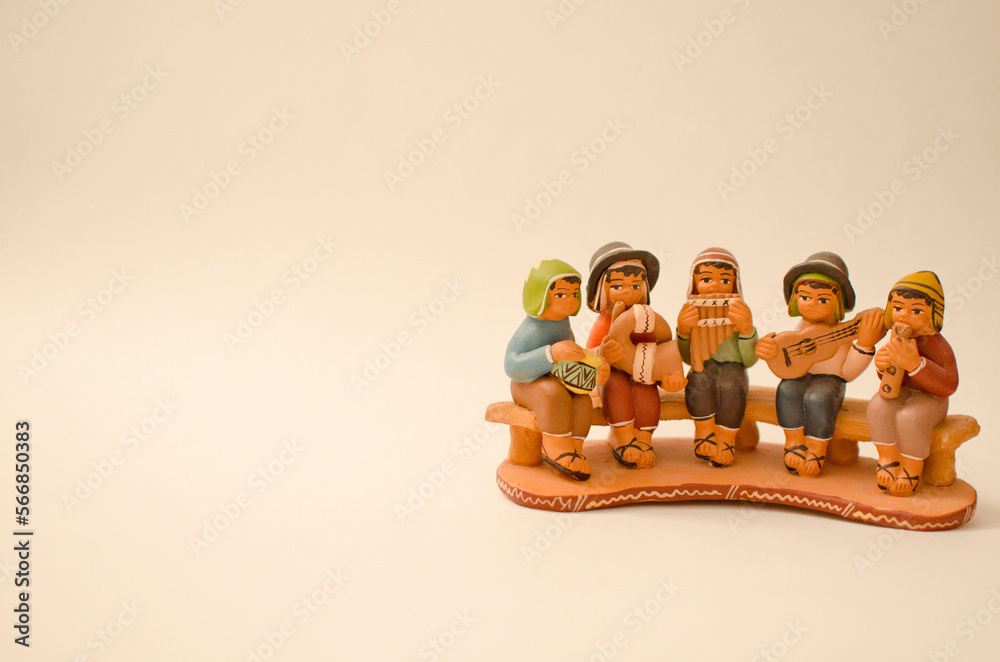 Peruvian handicraft in white background. Five musicians playing typical ...