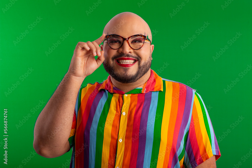 lgbt man wearing glasses, with make-up and a shirt with the colors of ...