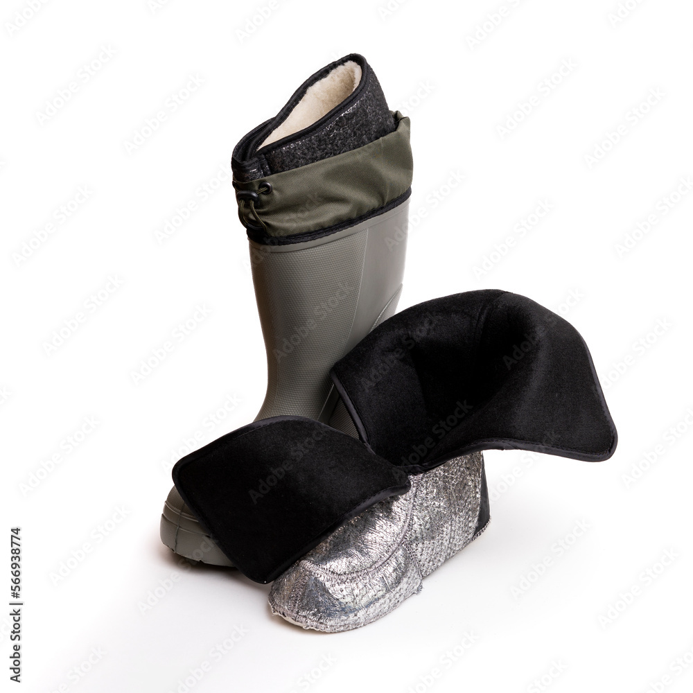 The insulation for a rubber fishing boot is insulated on a white ...