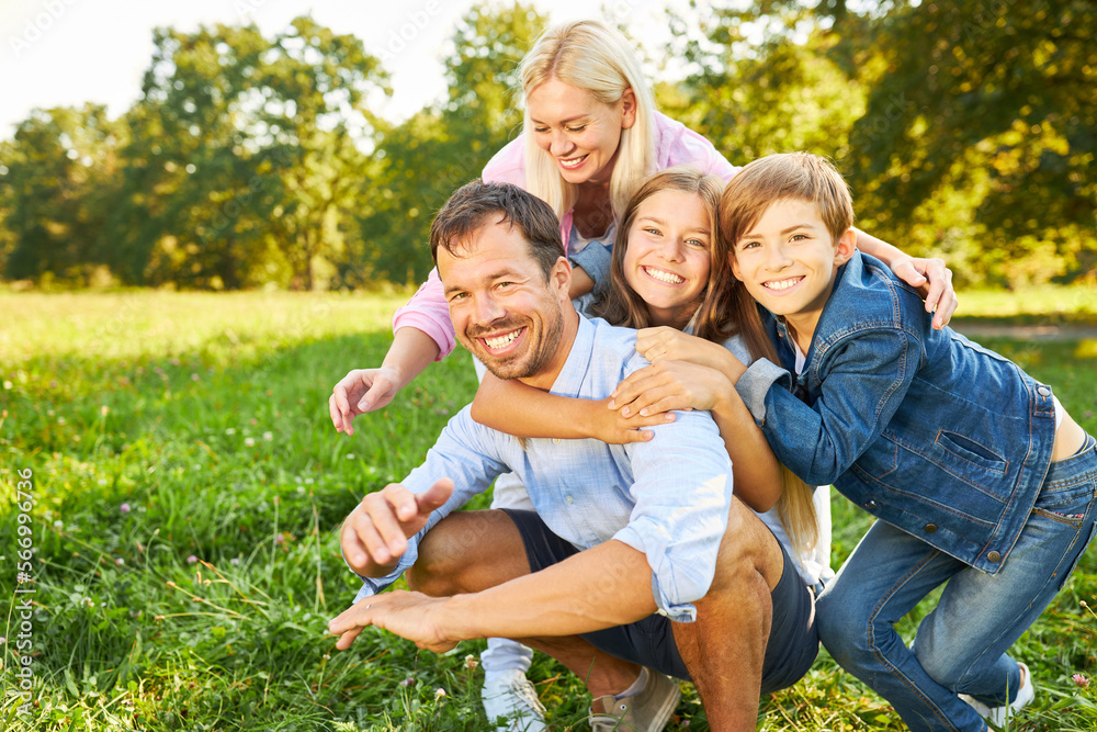 Happy parents and two children play together Stock Photo | Adobe Stock