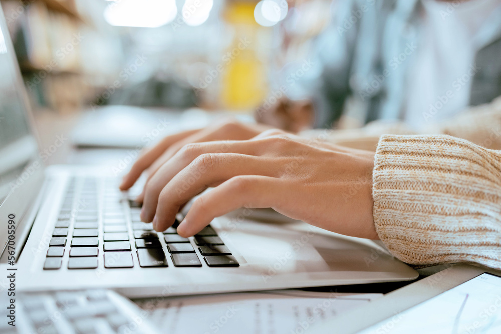 Closeup, student hands and typing on laptop at desk for studying ...