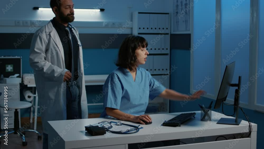 Practitioner medic aggressing nurse late at night in hospital office ...