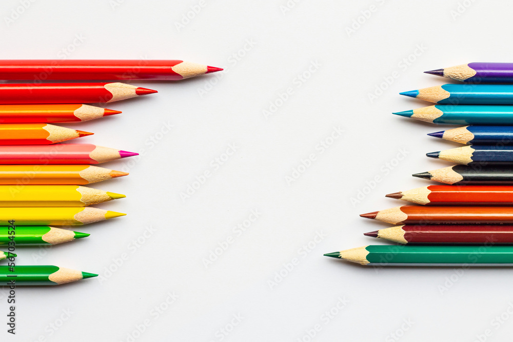 Set of colored pencils of different colors on blank sheet of white ...