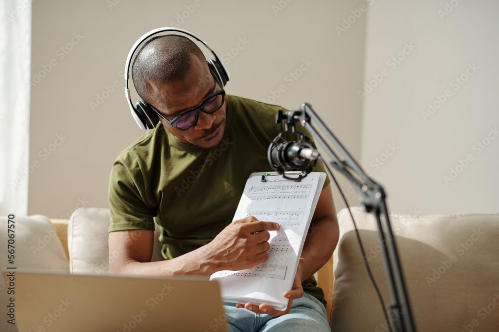 Music teacher conducting online class on music notes Stock Photo ...