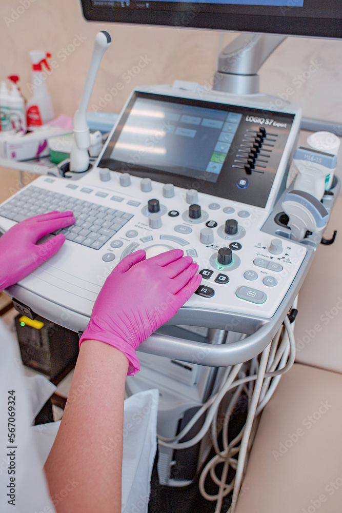 Probe for ultrasound diagnostics close-up. The doctor holds in his ...