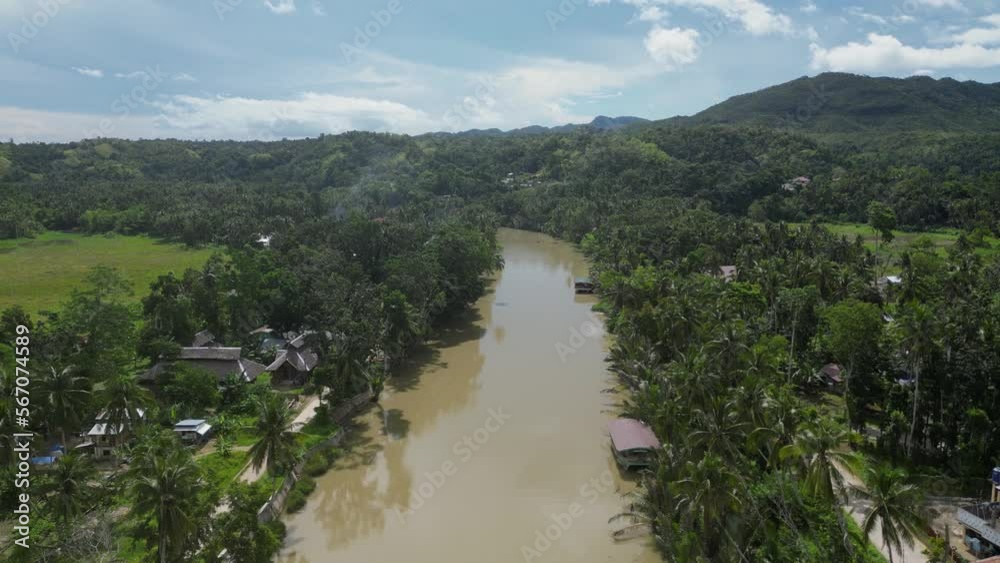 Wideo Stock: Drone shoots river with polluted water that flows through ...