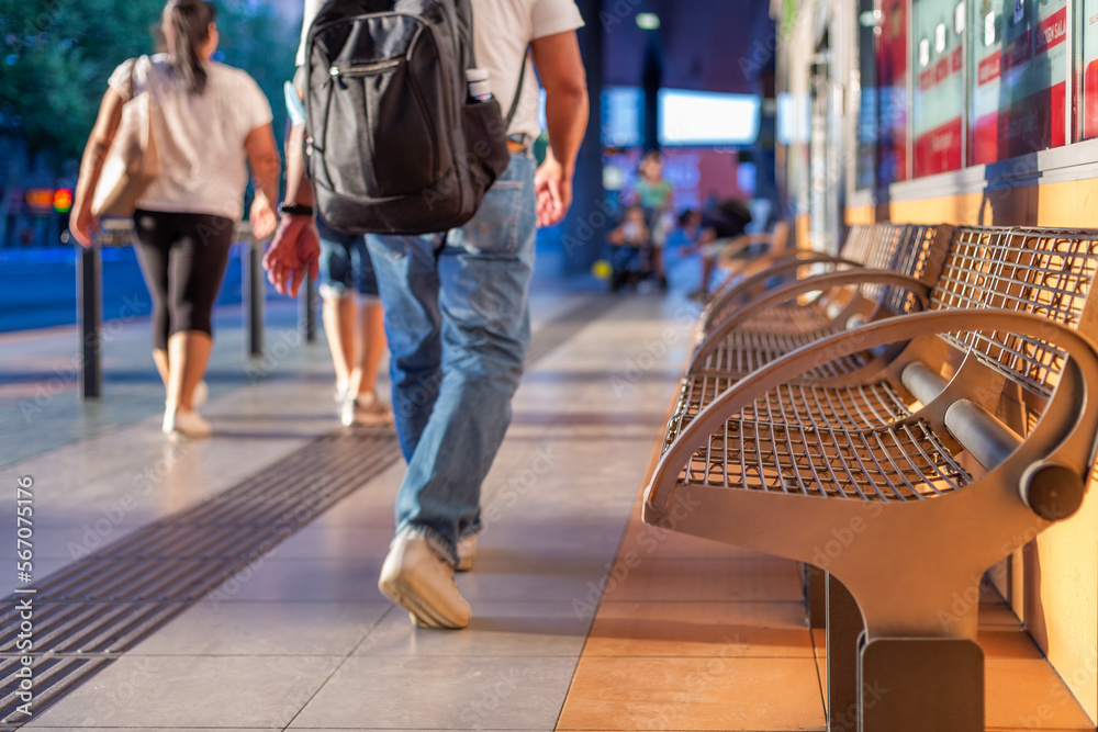 Madrid Spain.. Waiting benches and passengers walking and waiting at ...