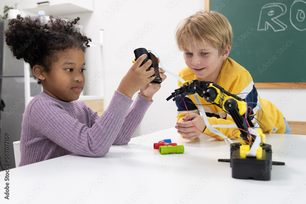 Elementary school students are sitting in the classroom at school and ...