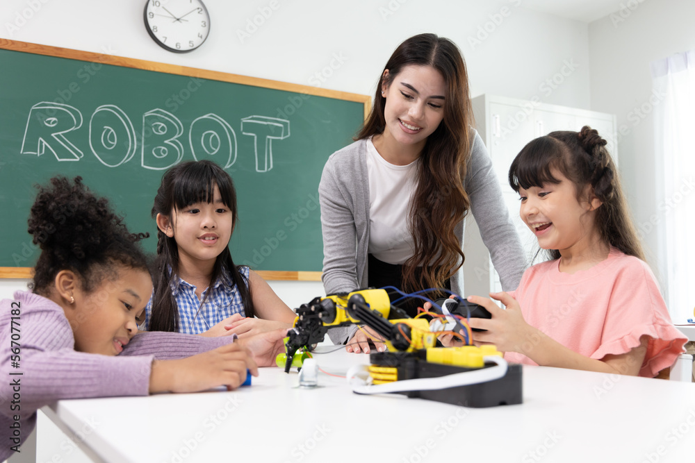 Elementary school students are sitting in the classroom at school and ...